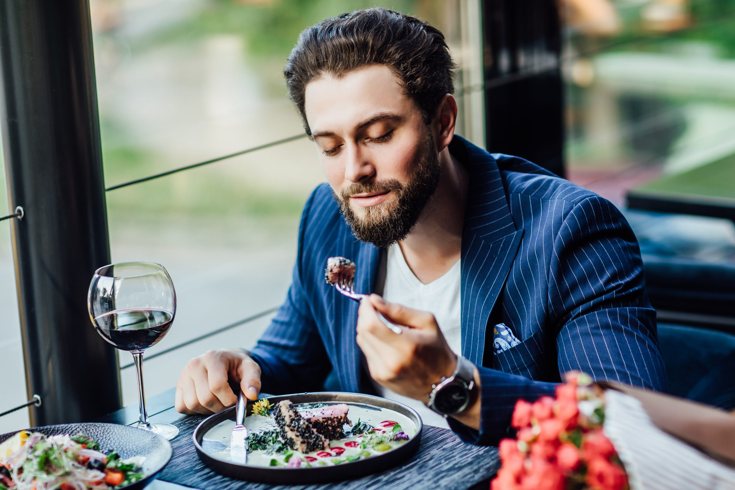 handsome-smiling-man-eat-salade-restaurant-waiting-woman-with-bouquet ...